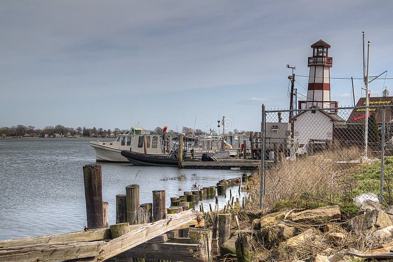 Boats Parked at Marina with Lighthouse Stock Photo - Image of harbor ...