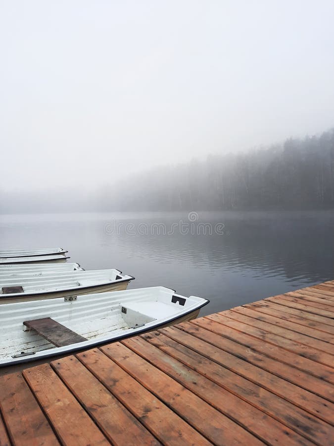 Boats at the pier stock photo. Image of lake, view, water - 238026756