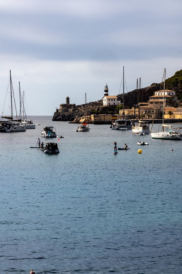 Boats in a Port with a Lighthouse in the Background Stock Photo - Image ...