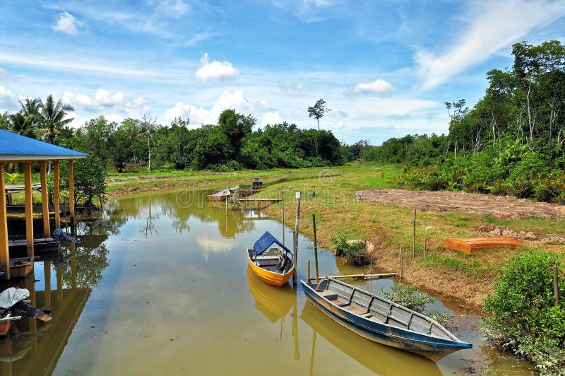 Boats Resting Along River in Asian Rural Area Stock Photo - Image of ...