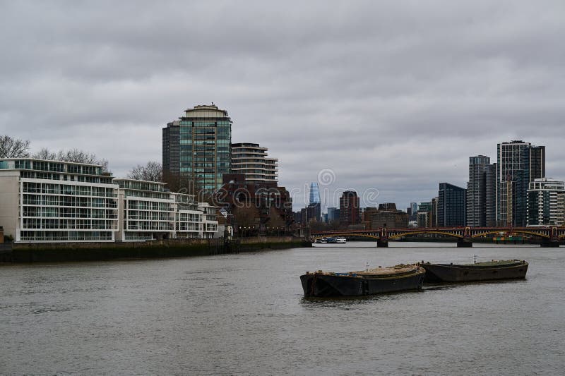 Boats on River Thames on Grey Overcast Cloudy Day with Apartments in ...