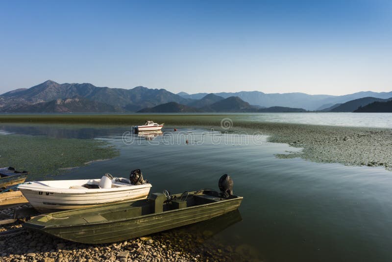 Boats on the Shore of Shkoder Lake Surrounded by Mountains , Montenegro ...