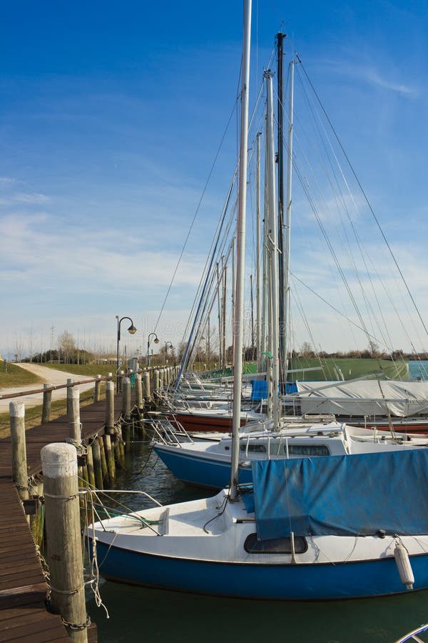 Boats in Small Port - Vertical Stock Image - Image of harbour, dock ...