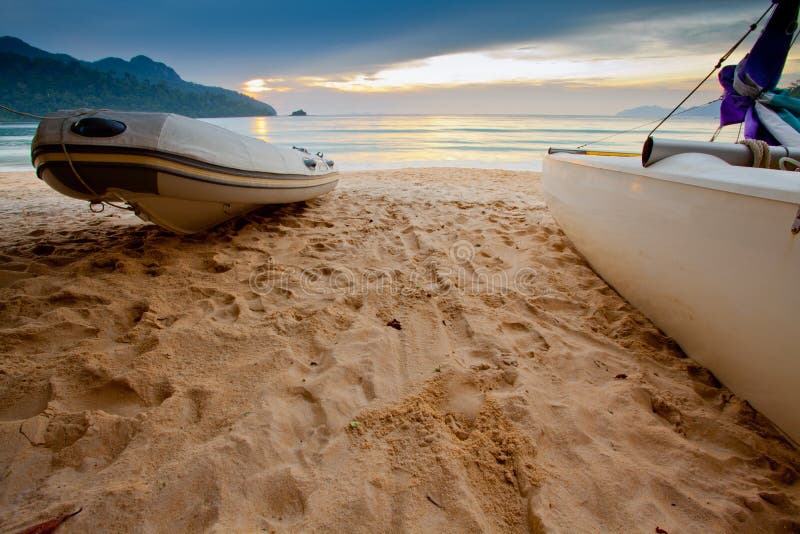 Canoe on the Ocean Beach during the Amazing Sunset. Stock Photo - Image ...