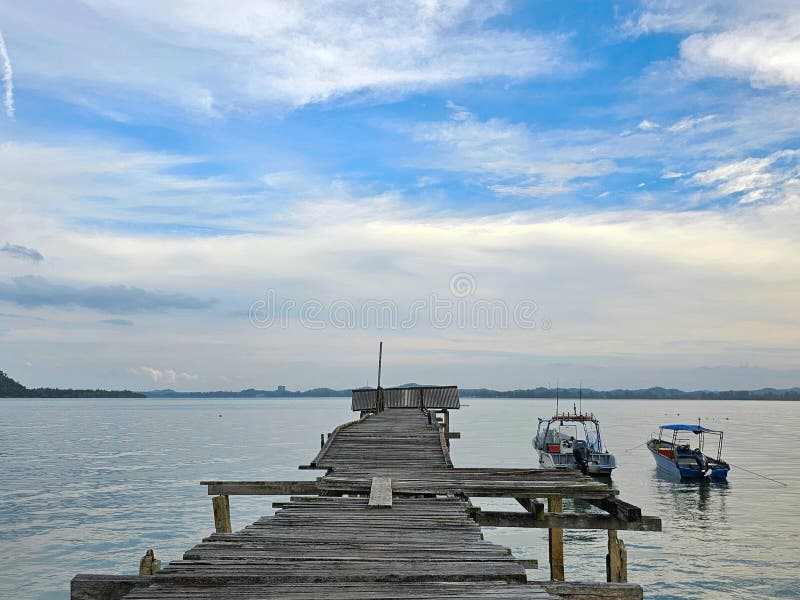 Boats at the wood jetty stock photo. Image of laut, wood - 285194272