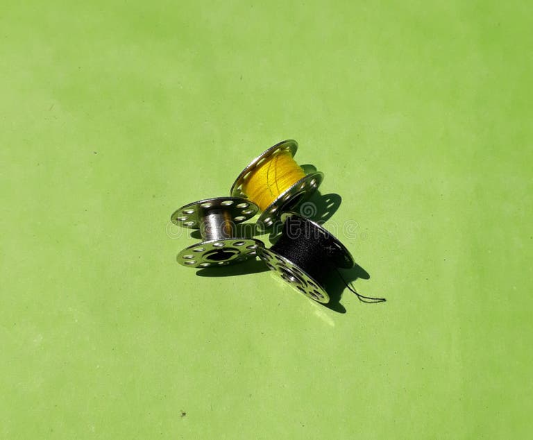 A bobbin or spool is a Spindle or Cylinder, with or without flanges, on ...