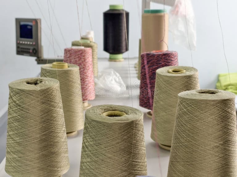 Bobbins of Cotton Yarn on a Knitting Machine during the Knitting ...