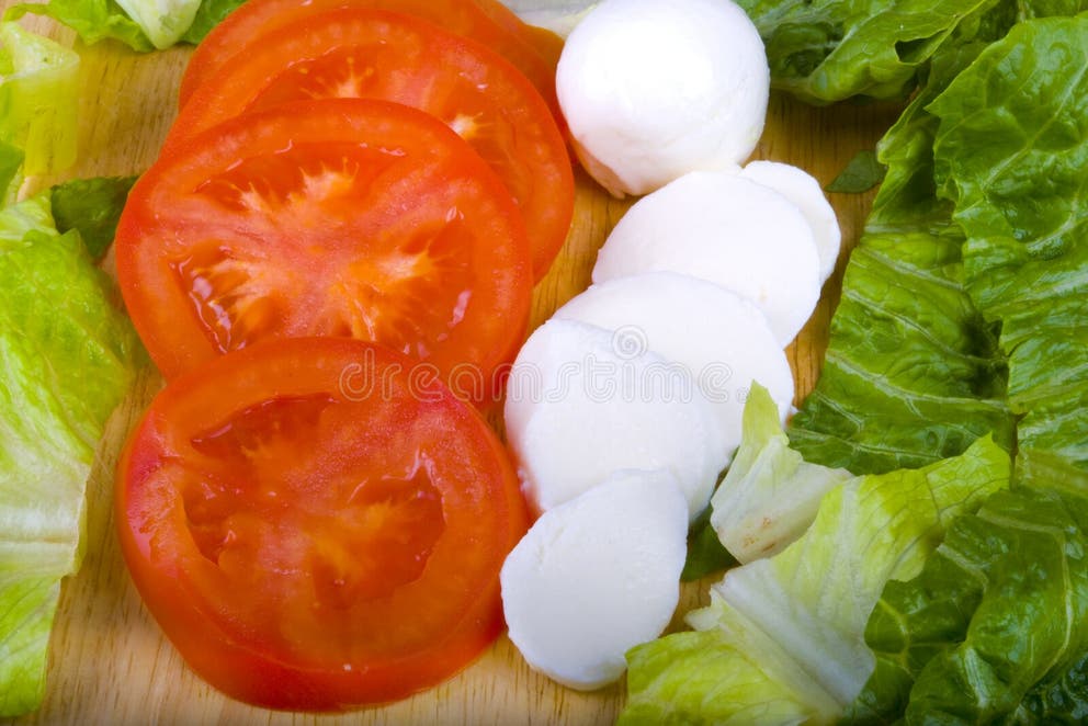 Bocconcini Cheese with Fresh Tomato and Lettuce Stock Photo - Image of ...