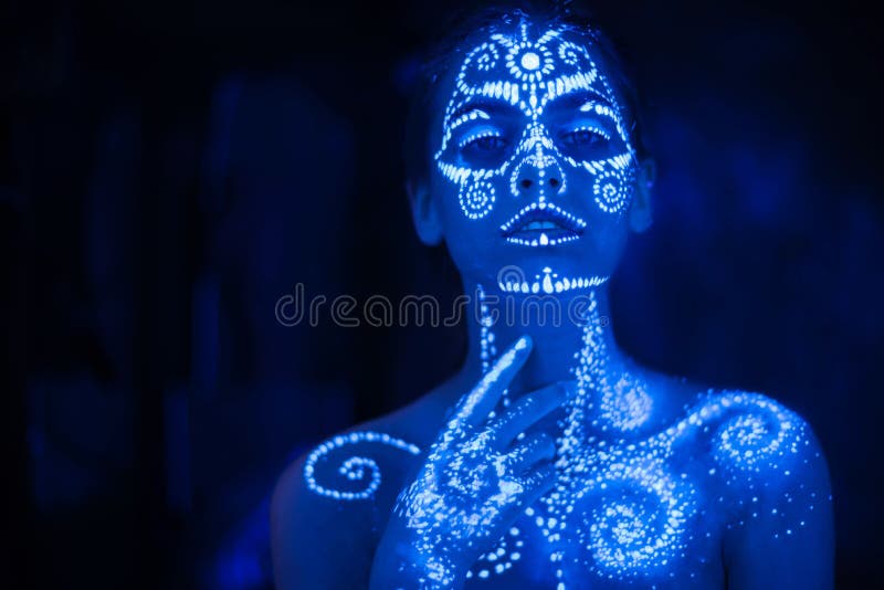 Body Art on the Body and Hand of a Girl Glowing in the Ultraviolet ...