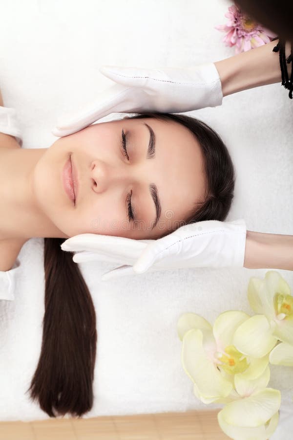 Face Massage. Close-up of a Young Woman Getting Spa Treatment. Stock ...