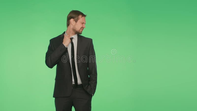 Body Language. a Man in a Business Suit on a Green Background Stock ...