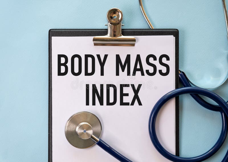 BODY MASS INDEX Text on a Card Clip To a Notepad on a Table Stock Image ...