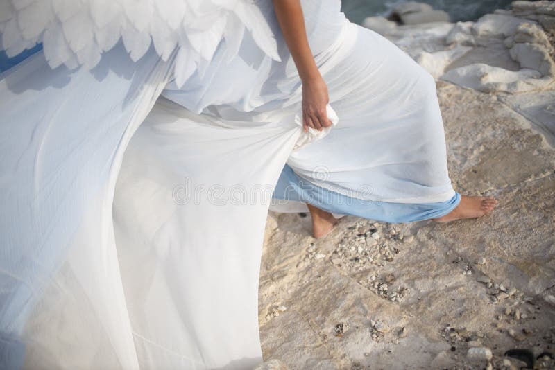 Body Part of an Angel Standing on a White Cliff Stock Photo - Image of ...