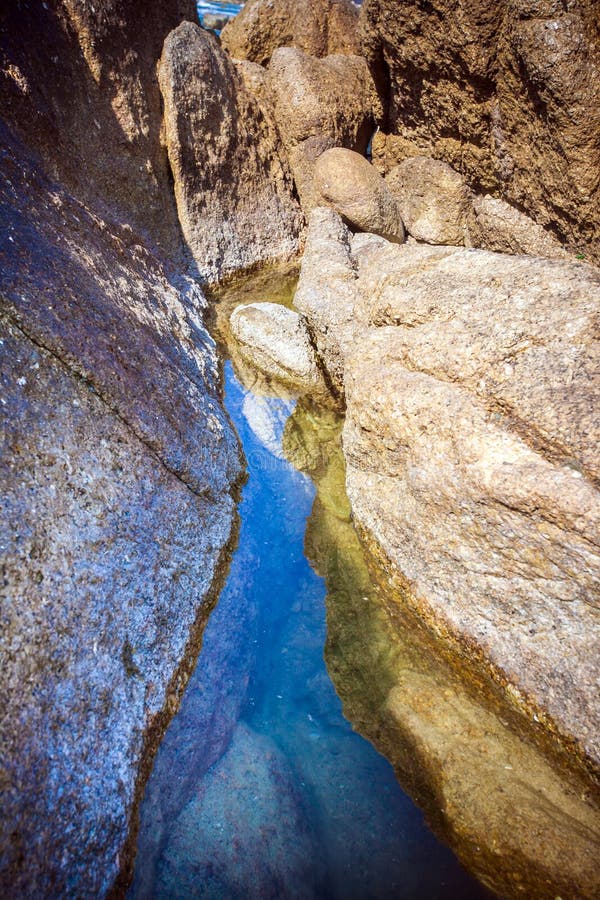 Body of Water between Gentle Colored Stones Stock Image - Image of lake ...