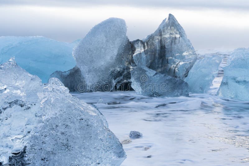 Body of Water Featuring Several Large Chunks of Ice Floating on the ...