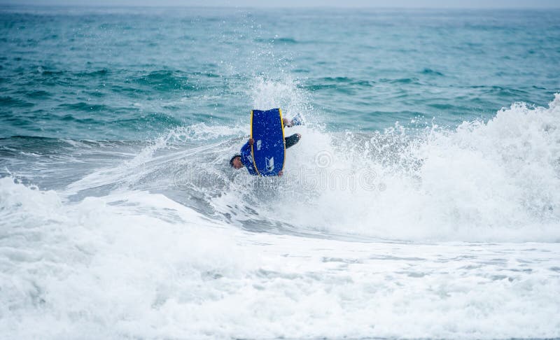 Bodyboarder in Action on the Ocean Waves on a Sunny Day. Stock Photo ...