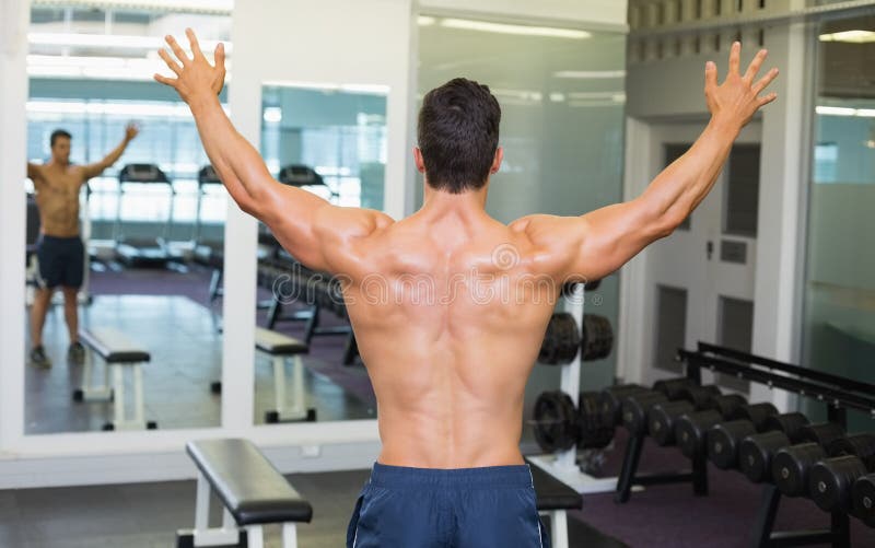 Bodybuilder with Arms Outstretched in Gym Stock Image - Image of ...