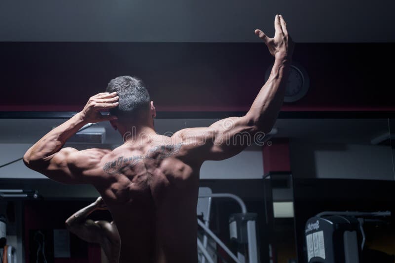 Bodybuilder from back stock photo. Image of builder, confident - 65950004