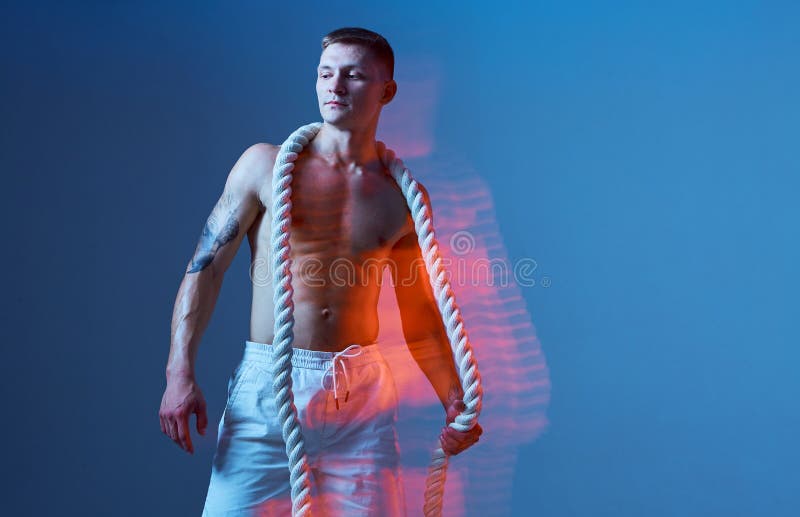 Isolated Figure of Half Naked Bodybuilder with the Rope in Studio on ...