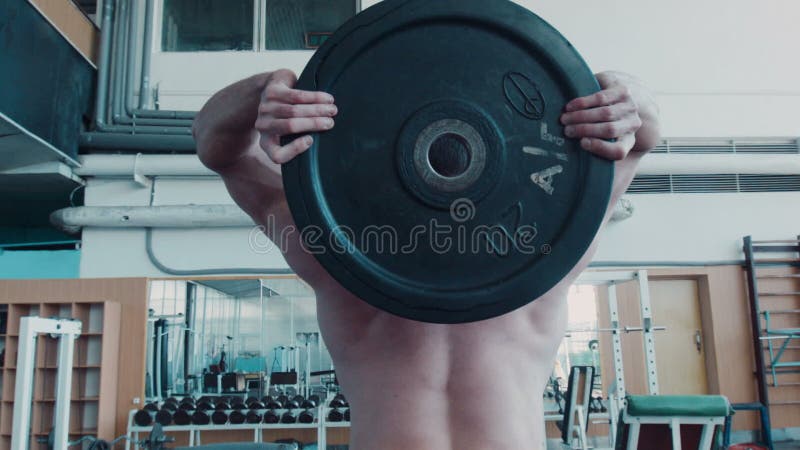 Bodybuilder Does Rotating Exercise with Barbell Stock Video - Video of ...