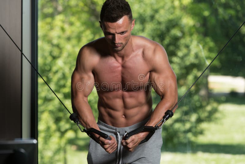Bodybuilder Doing Exercise for Chest on Machine Stock Photo - Image of ...