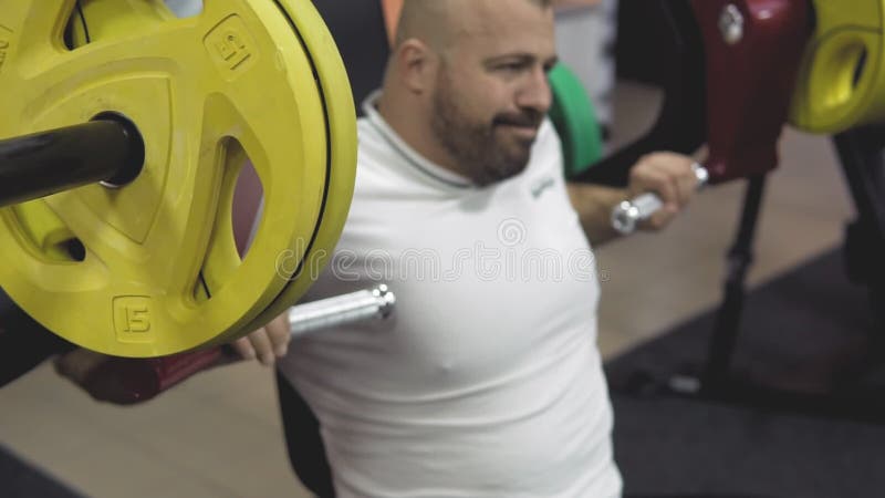 Bodybuilder Doing Exercise on Simulator in Gym. Man Flexing Chest ...