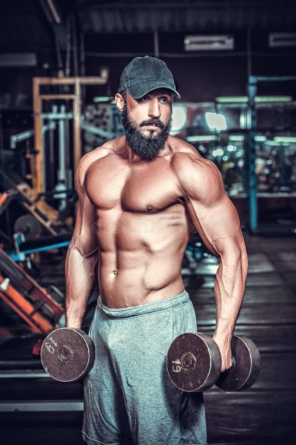 Bodybuilder Doing Exercises with Dumbbells Stock Image - Image of ...