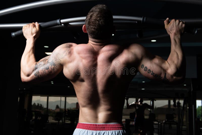 Man Athlete Exercising Glutes on Machine Stock Photo - Image of ...