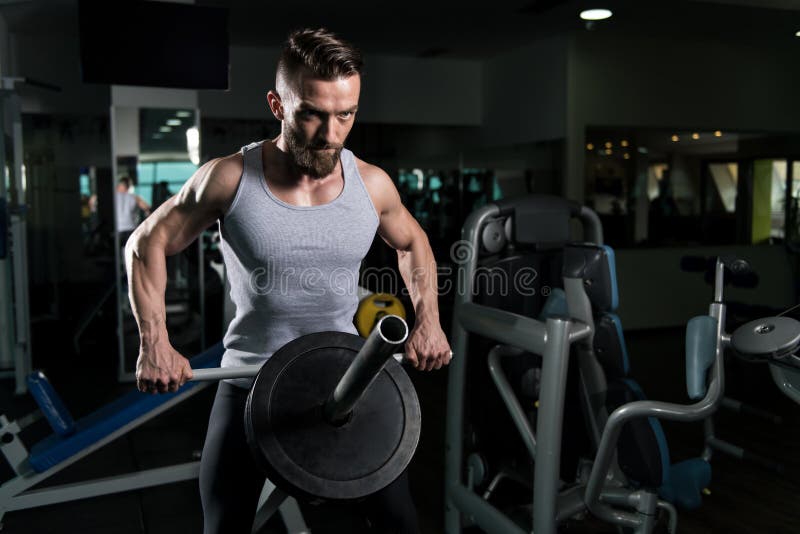 Bodybuilder Exercising Back in Gym with Weights Stock Image - Image of ...