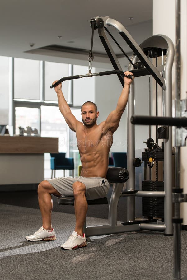Bodybuilder Exercising Back on Machine Stock Image - Image of human ...