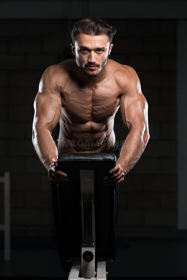 Bodybuilder Exercising Push Ups on Bench Stock Image - Image of ...