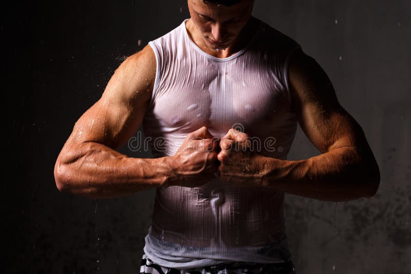 Athlete Bodybuilder Trains in the Studio in the Rain. Stock Image ...