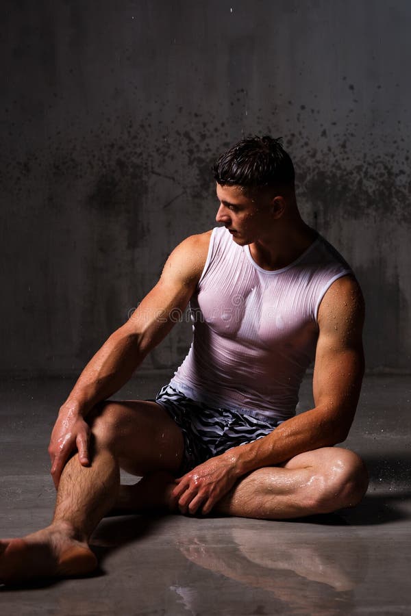 Athlete Bodybuilder Trains in the Studio in the Rain. Stock Image ...