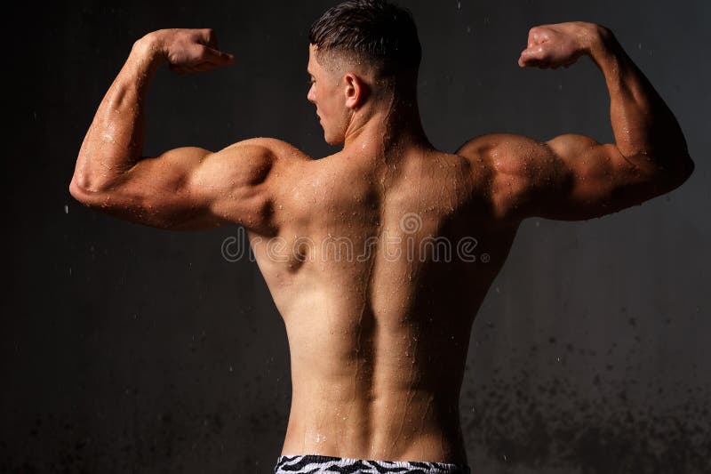 Athlete Bodybuilder Trains in the Studio in the Rain. Stock Image ...
