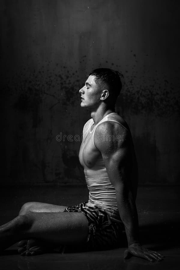 Athlete Bodybuilder Trains in the Studio in the Rain. Stock Image ...