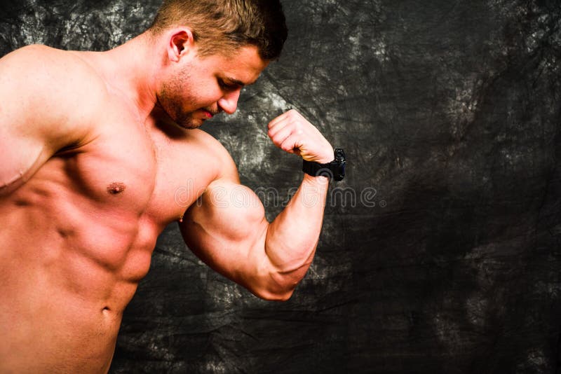 Bodybuilder Flexing Muscles on a Rooftop Stock Photo - Image of adult ...