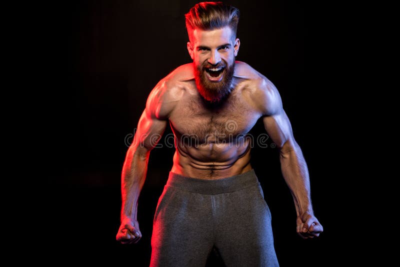 Bodybuilder Gesturing and Yelling Isolated on Black with Dramatic ...