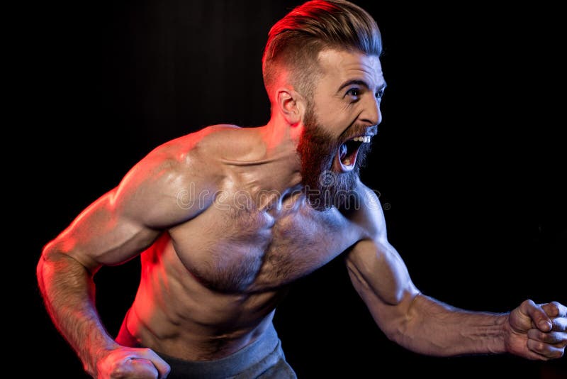 Bodybuilder Gesturing and Yelling Isolated on Black with Dramatic ...