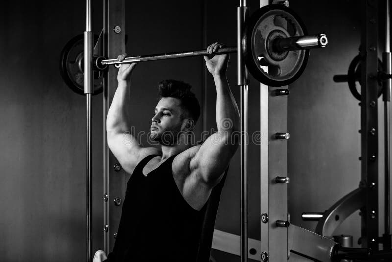 Bodybuilder Guy in Gym with Heavy Weights Monochrome Stock Photo ...