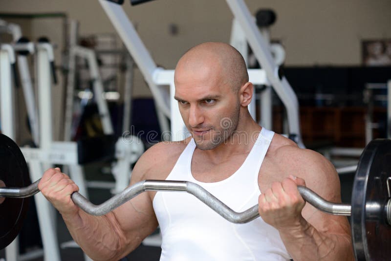 Bodybuilder in gym stock image. Image of action, person - 31326921