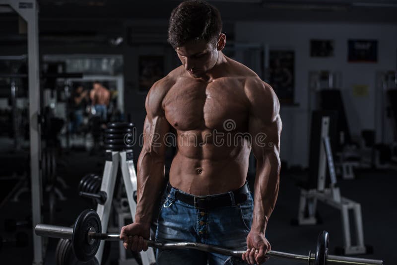 Bodybuilder in the gym stock photo. Image of male, dumbbell - 63424266