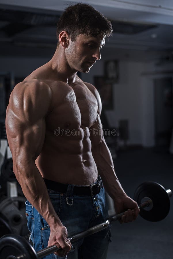 Bodybuilder in the gym stock photo. Image of male, dumbbell - 63424266