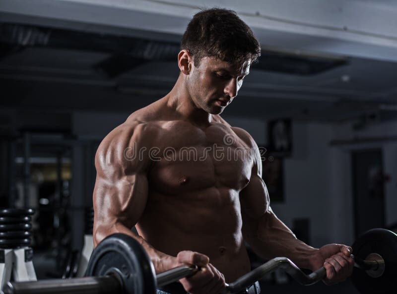 Bodybuilder in the gym stock photo. Image of male, dumbbell - 63424266