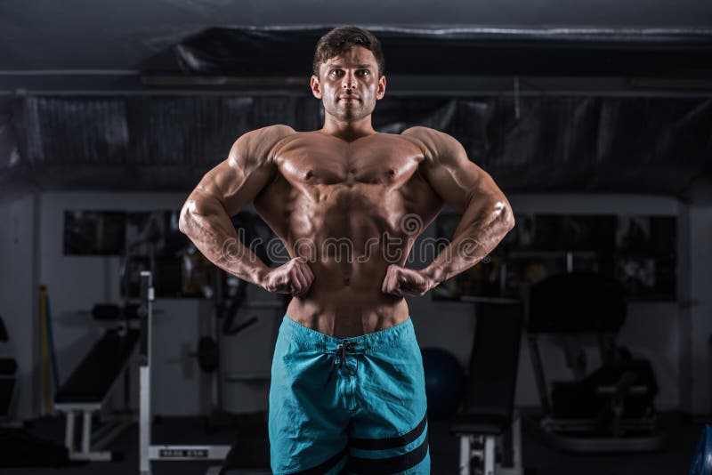 Bodybuilder in the gym stock photo. Image of male, dumbbell - 63424266