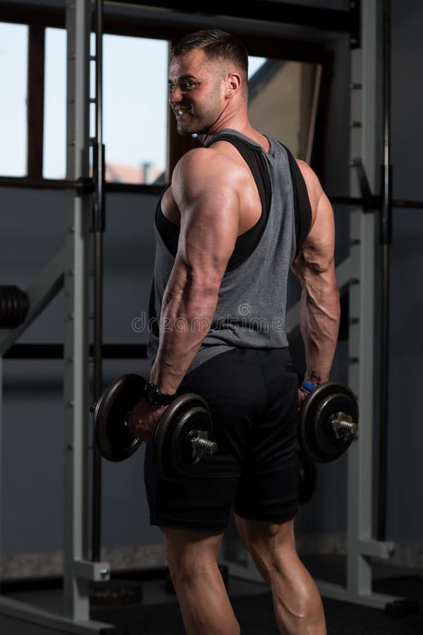 Bodybuilder Holding Weights in Hand Stock Image - Image of adult ...
