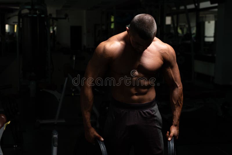 Bodybuilder Holding Weights in Hand Stock Photo - Image of people ...