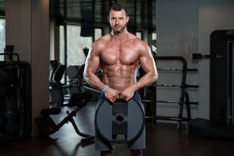Bodybuilder Holding Weights in Hand Stock Image - Image of healthy ...
