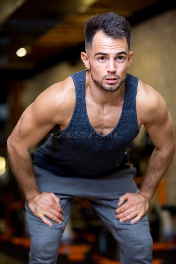 Man Leaning in Forward Stretch and Holding Feet Stock Image - Image of ...