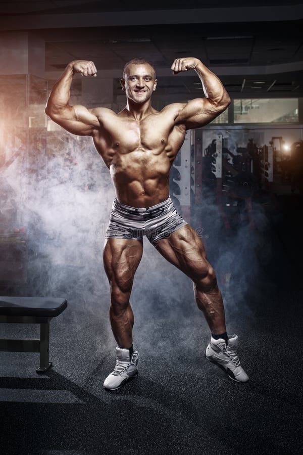 Bodybuilder Man Standing with Barbell, Workout in Gym Stock Photo ...