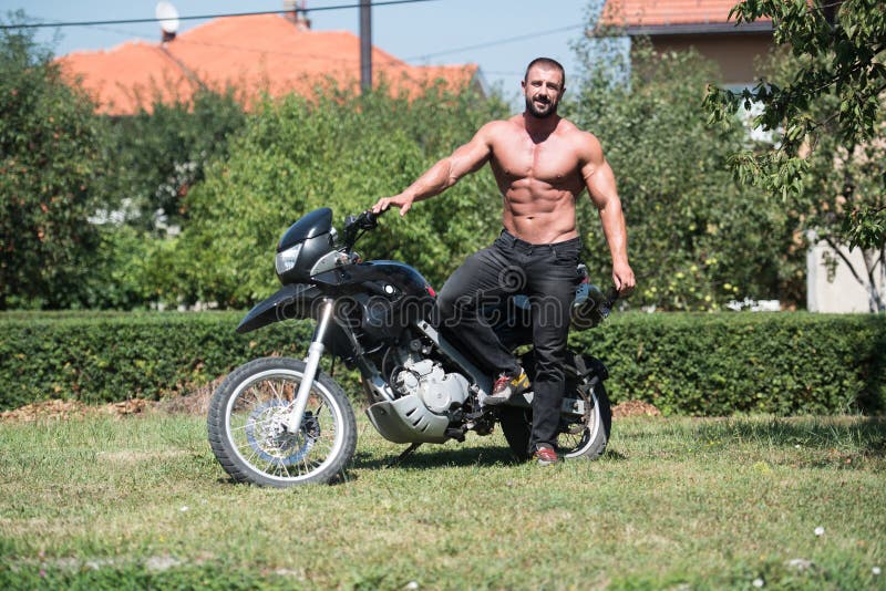 Bodybuilder and Motorcycle stock photo. Image of motorcycle - 173362894